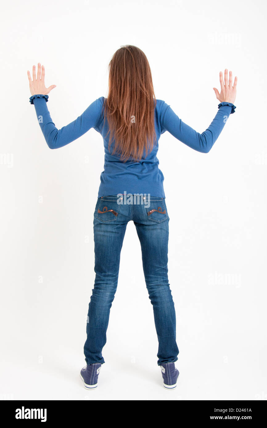Young woman with hands up Stock Photo - Alamy