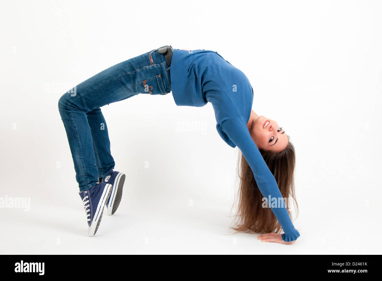 Young woman performing bridge Stock Photo - Alamy
