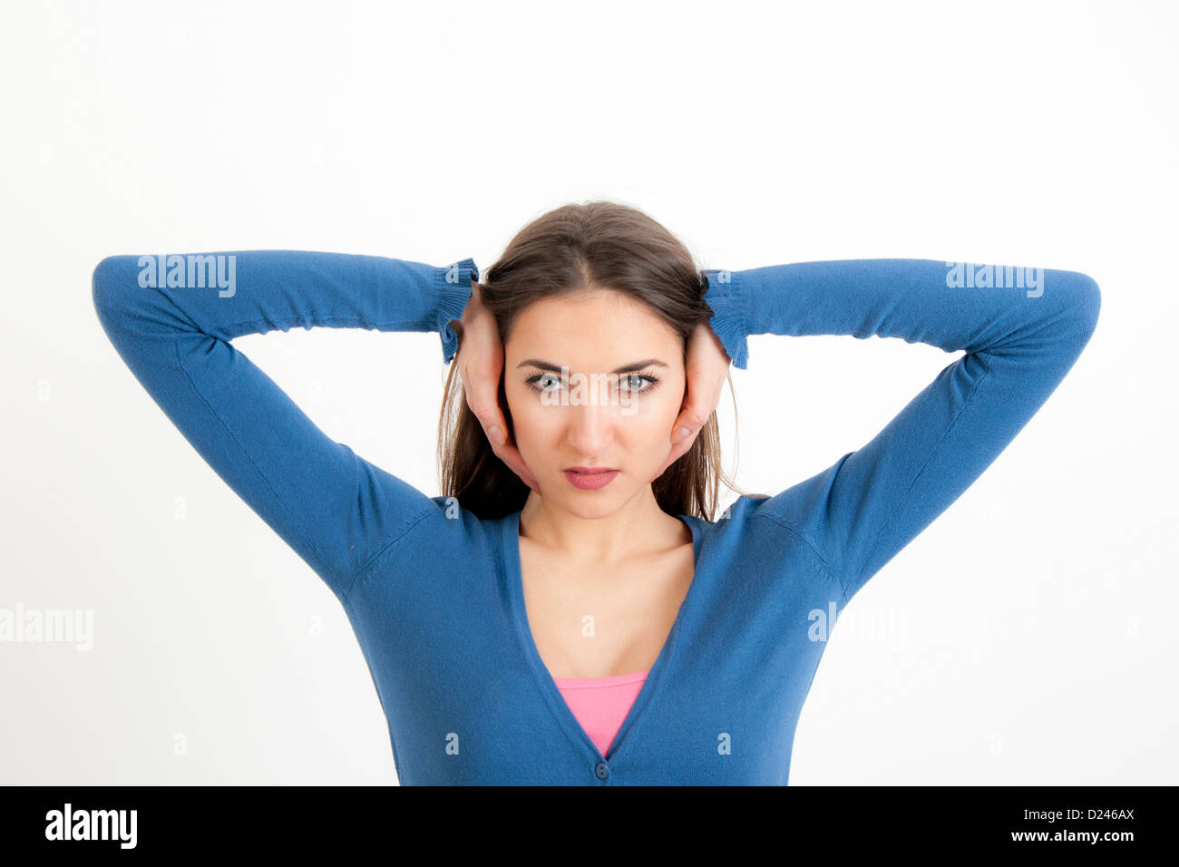 Woman plugging her ears Stock Photo - Alamy