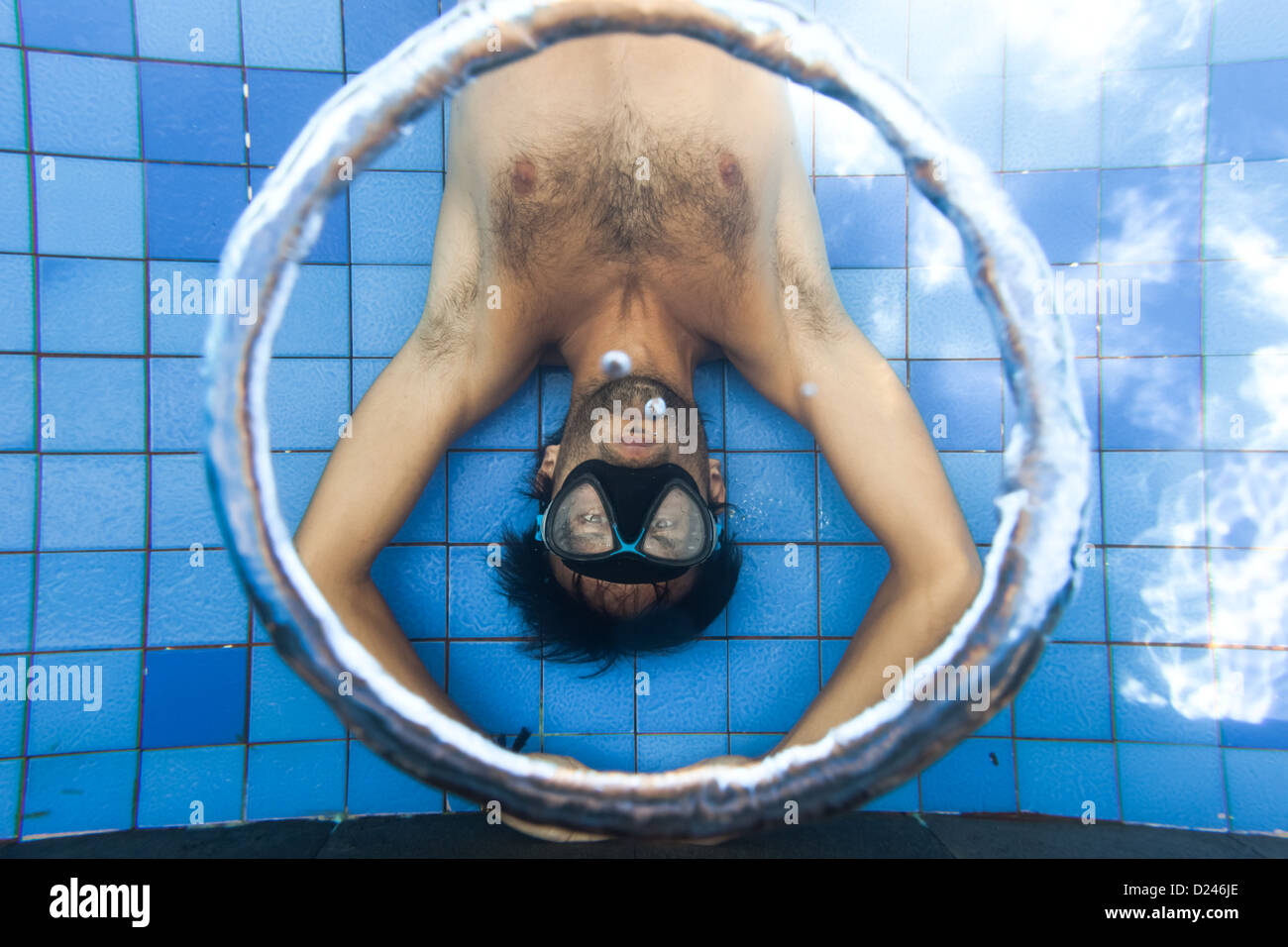 Man making bubble rings underwater in pool Stock Photo - Alamy