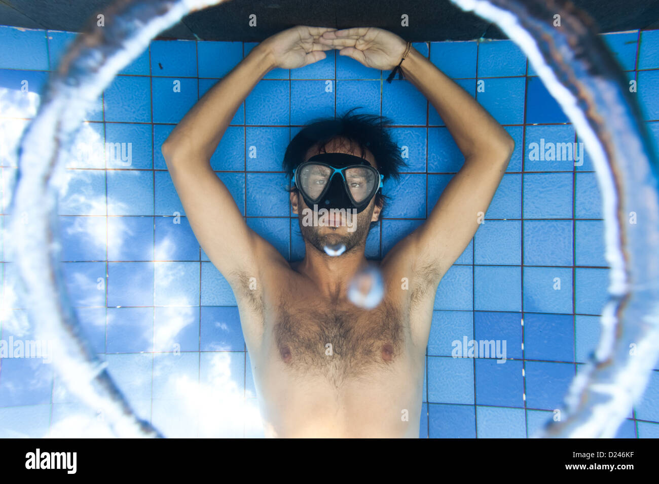 Man making bubble rings underwater in pool Stock Photo - Alamy