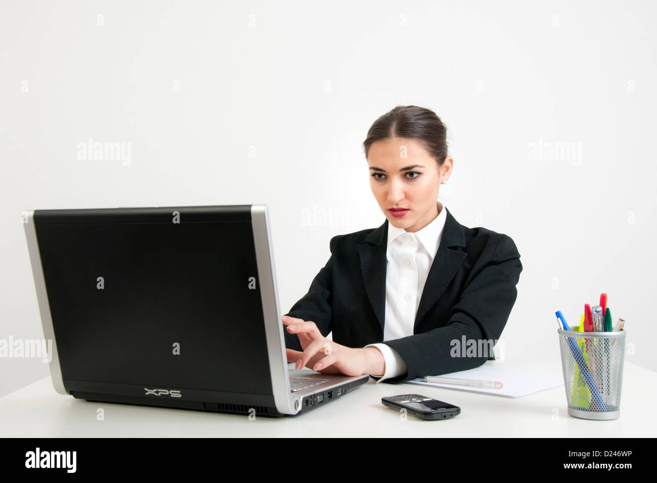 Young woman working on computer Stock Photo - Alamy
