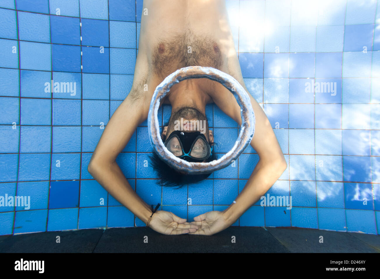 Man making bubble rings underwater in pool Stock Photo - Alamy