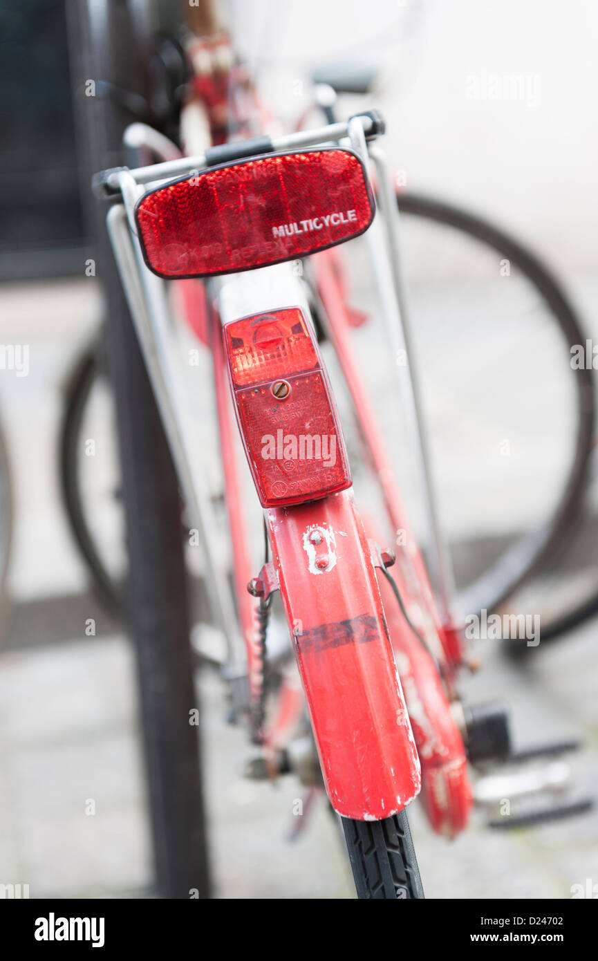 PARIS, FRANCE: Old red painted bicycle parked on the street Stock Photo ...
