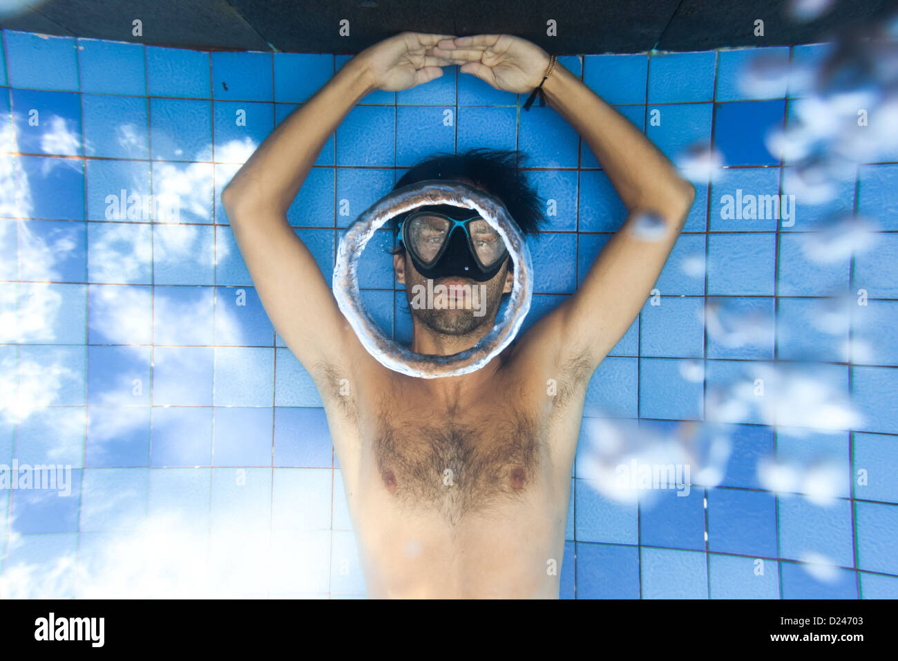 Man making bubble rings underwater in pool Stock Photo - Alamy