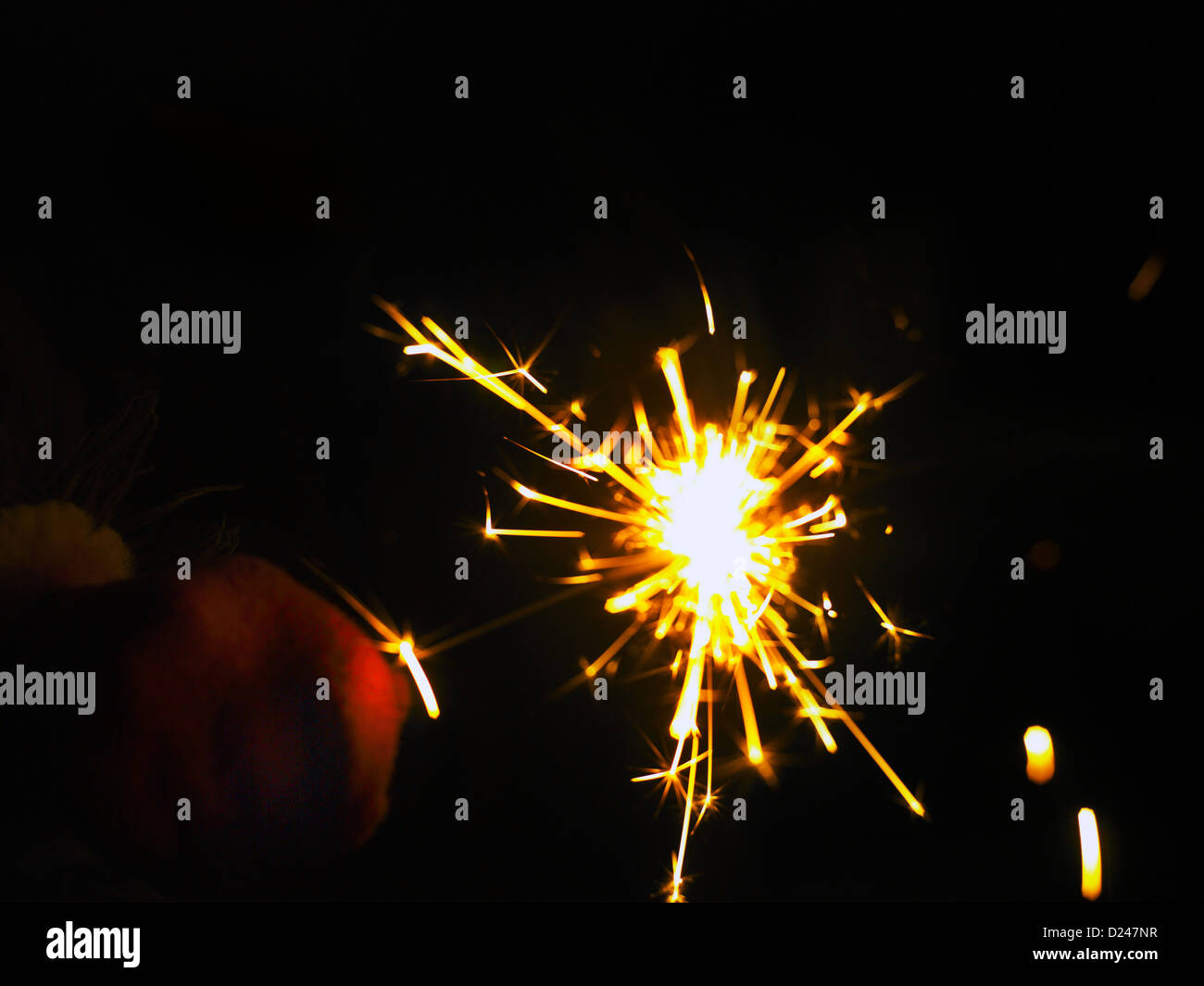 Hand Holding Sparkler at Fireworks Stock Photo - Alamy
