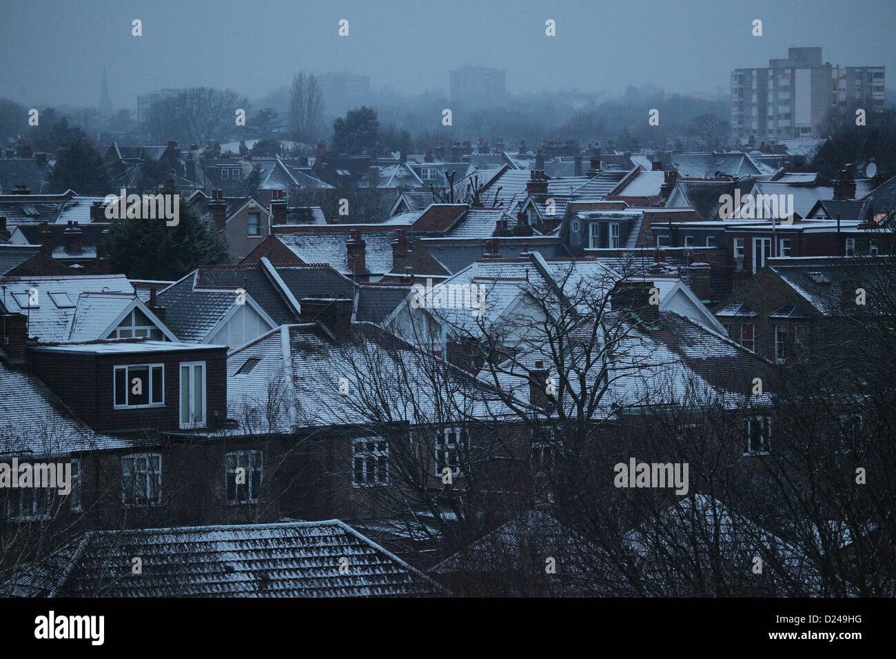 London, UK. 14th January 2013. Acton Snow settling on London rooftops ...