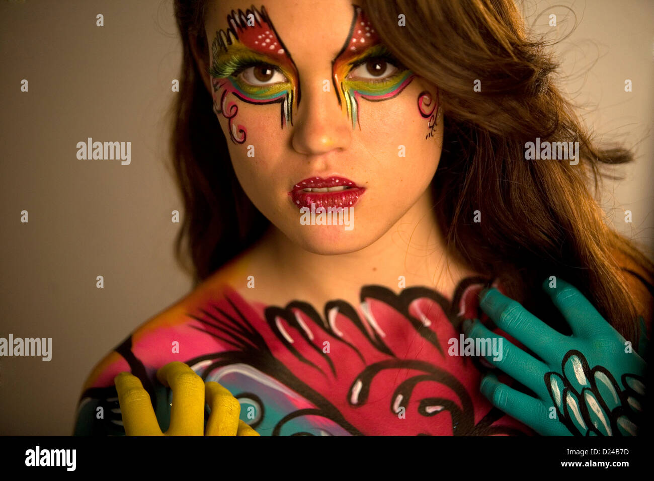 A model poses during a body painting session with make-up artist Erika ...