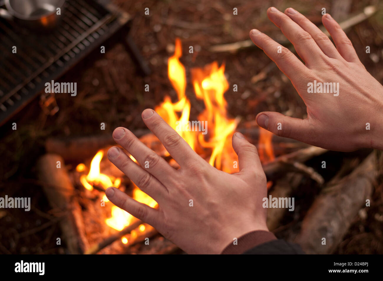Warming fire hands hi-res stock photography and images - Alamy