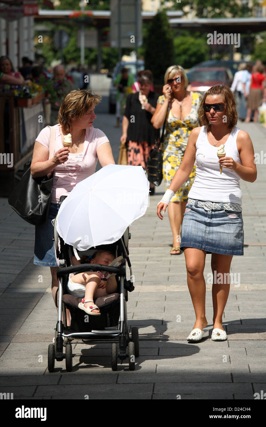 Karlovy Vary, Czech Republic, women with strollers on the street eating ...