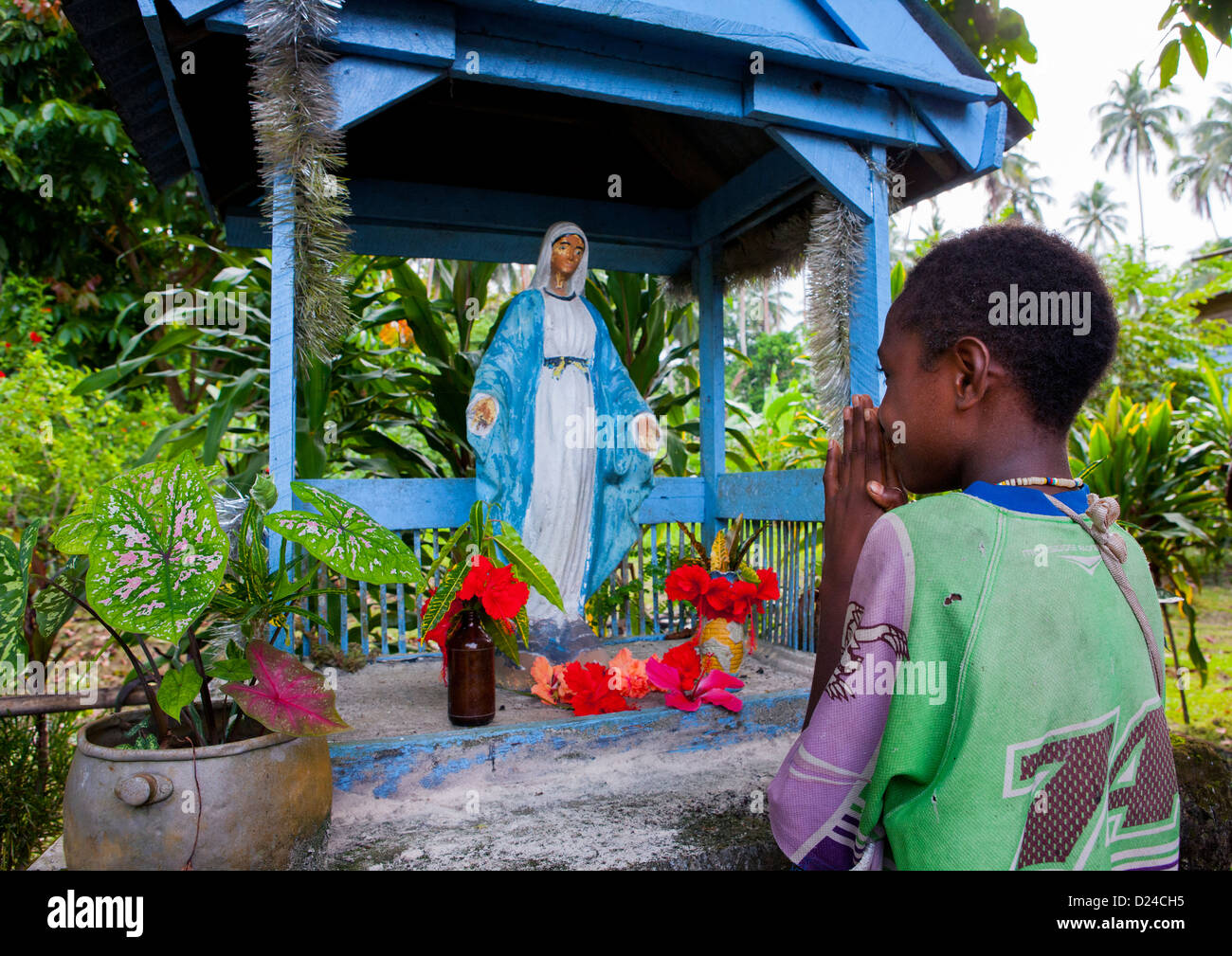 Youg Girl Praying In Front Of Virgin Maria Statue, New Ireland Island ...