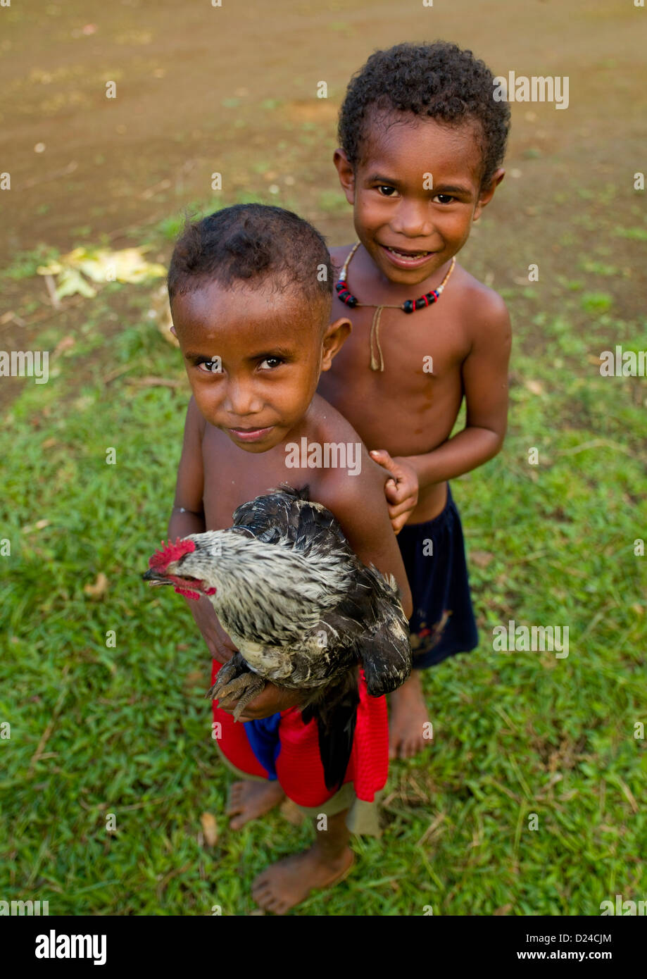 Kids With A Chicken, Trobriand Island, Papua New Guinea Stock Photo - Alamy