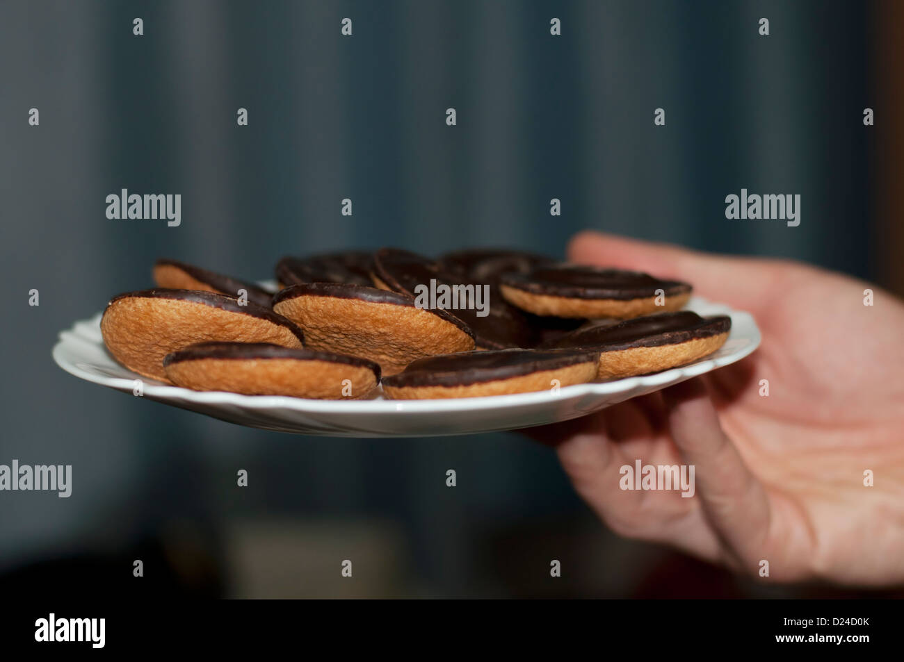 Young man giving cookies hi-res stock photography and images - Alamy