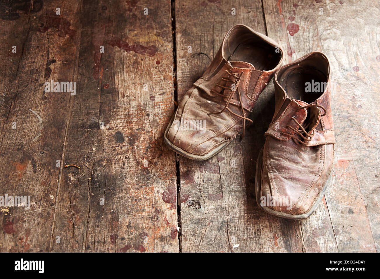 Worn shoes poverty hi-res stock photography and images - Alamy