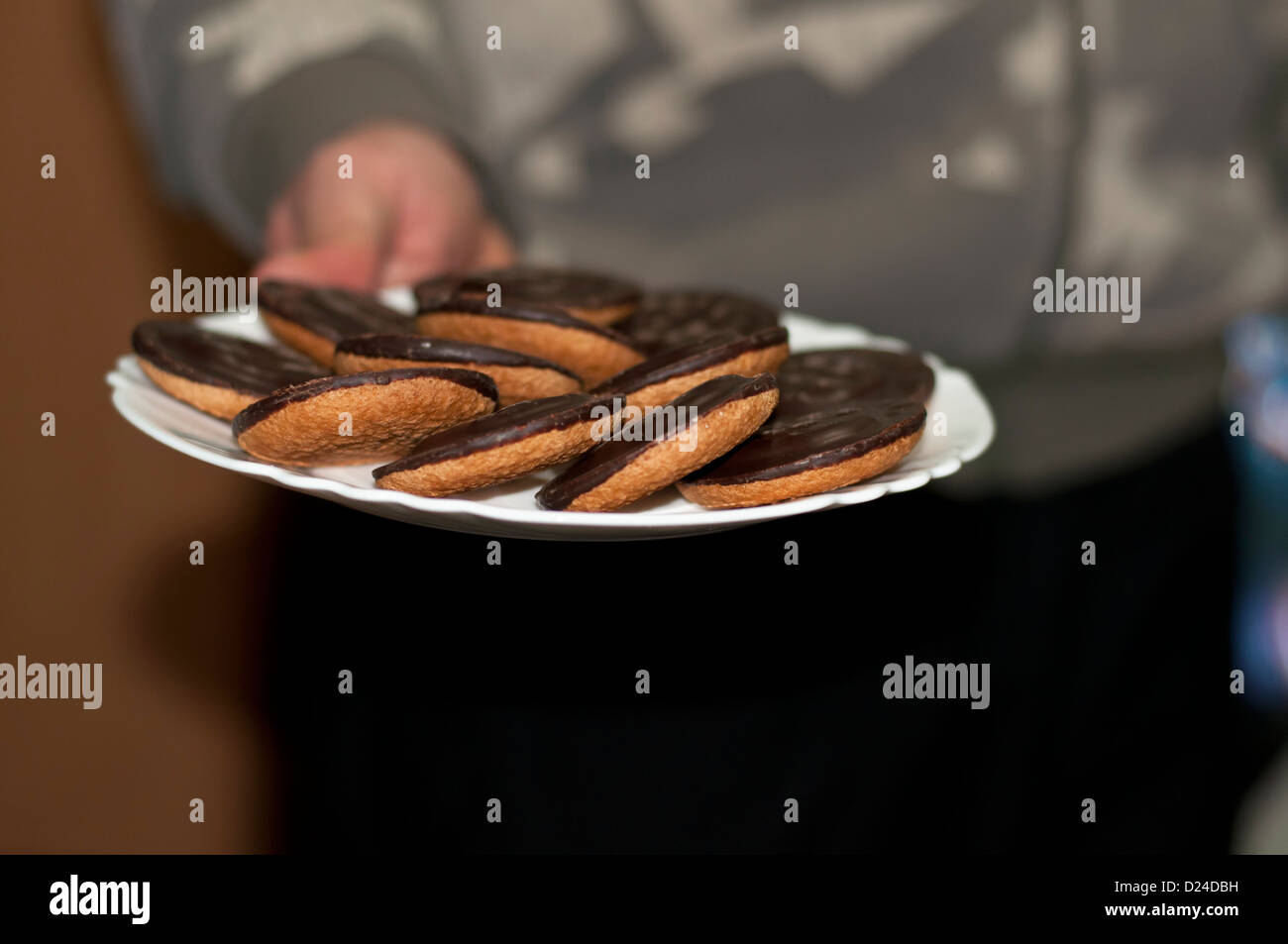 Hand offering plate hi-res stock photography and images - Alamy