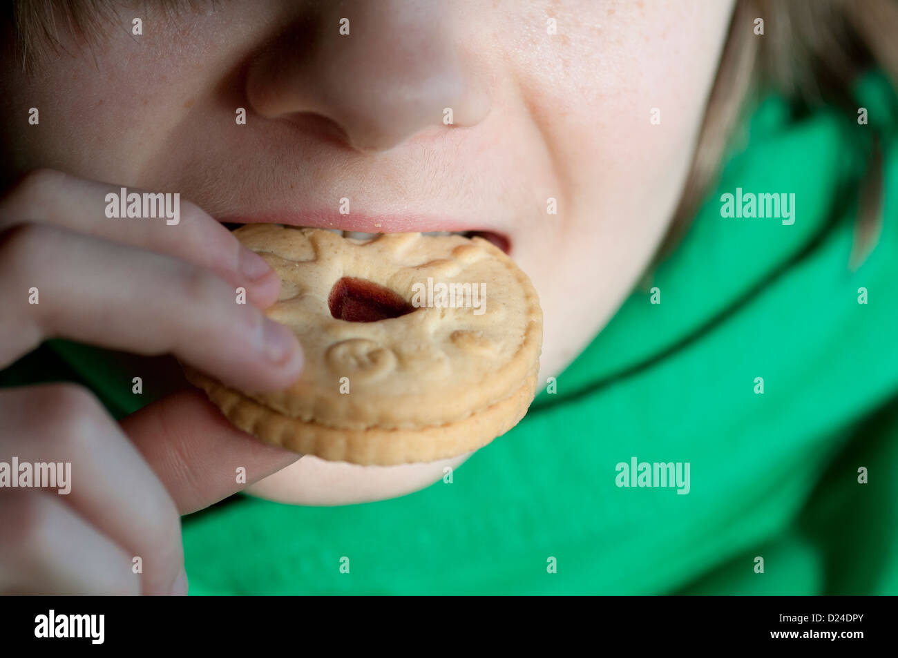 Hungry child eating biscuit hi-res stock photography and images - Alamy