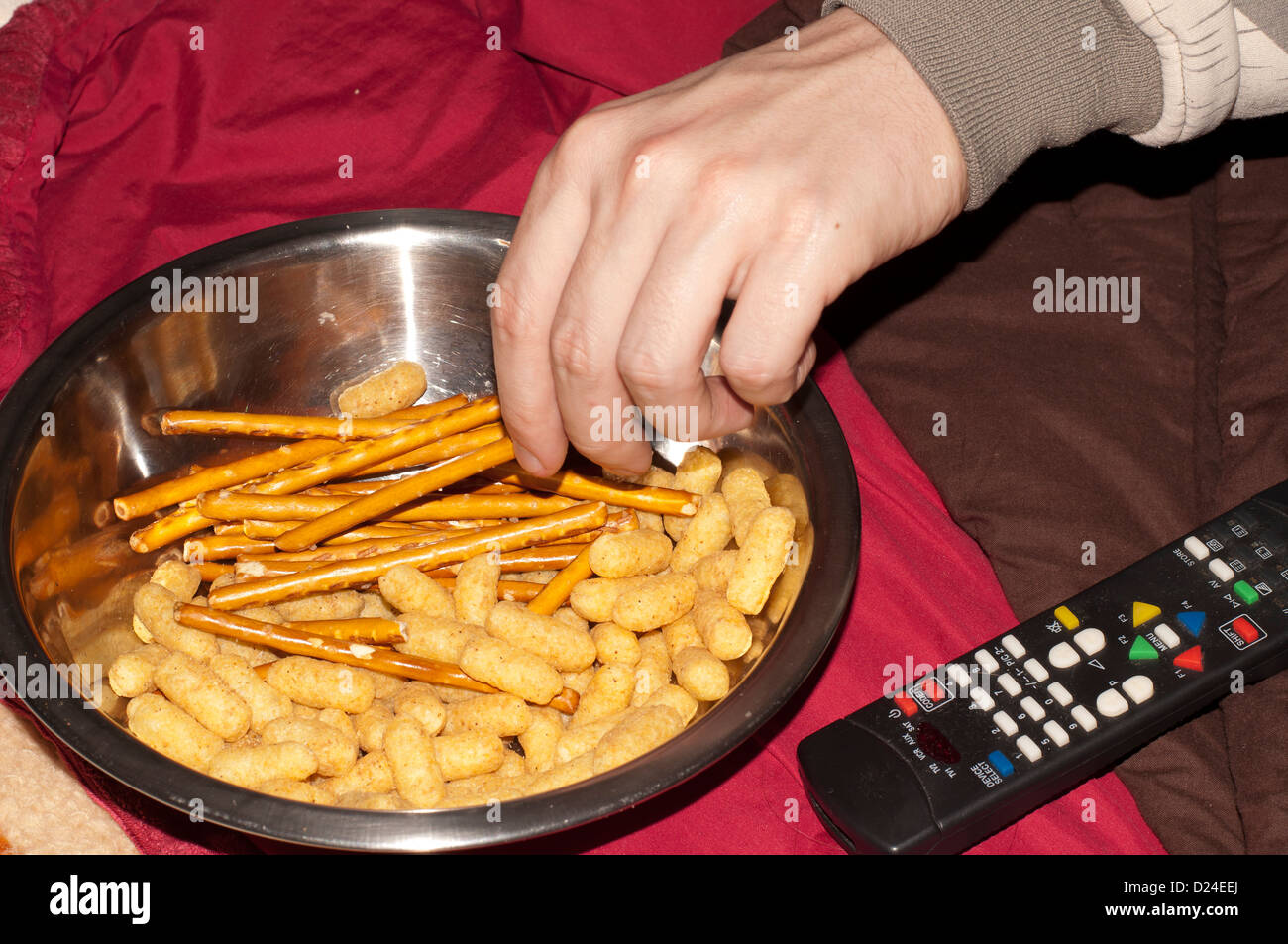 Reaching for snacks Stock Photo - Alamy