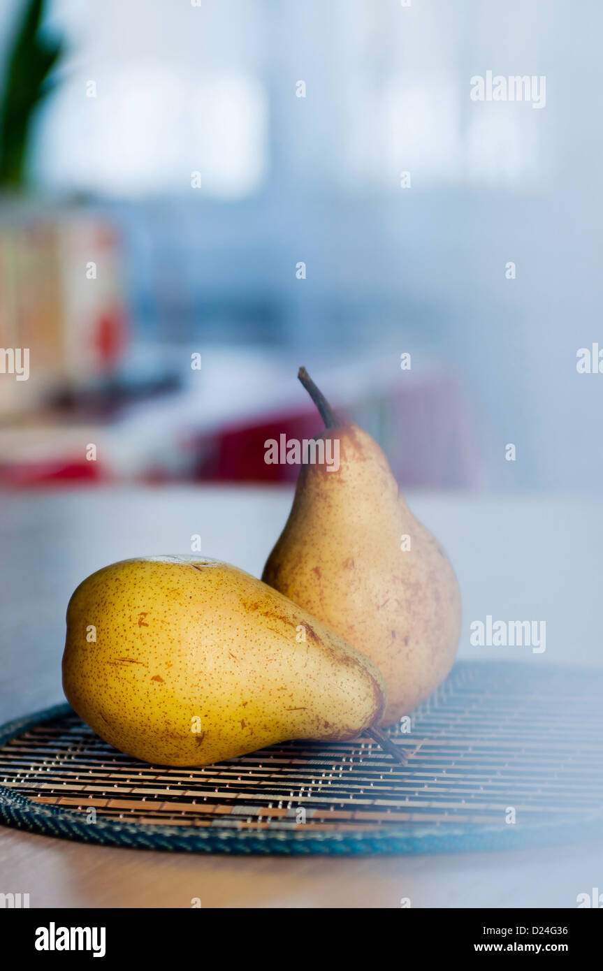 Two natural pears on the table to the breakfast Stock Photo - Alamy