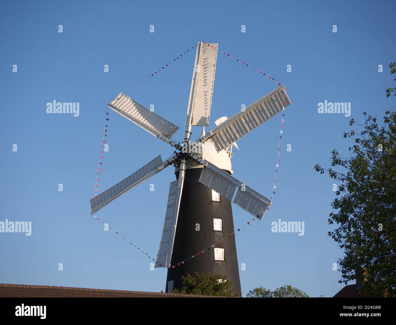 Waltham windmill with it's sails decked out in bunting to celebrate the ...