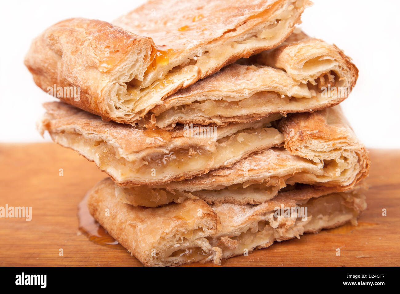 piece of slice thin sweet pie on wooden board Stock Photo - Alamy