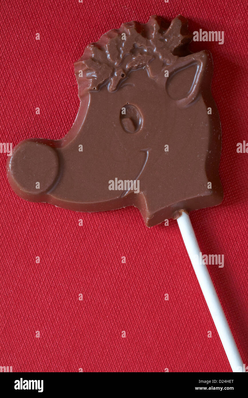 handmade milk chocolate reindeer head lolly lollipop set on red ...