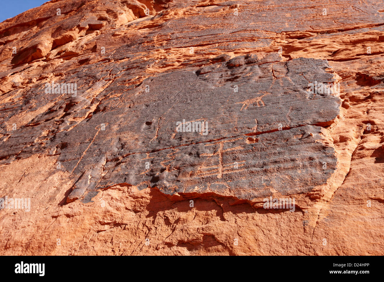 petroglyphs on sandstone rock cliff face on mouses tank trail valley of ...
