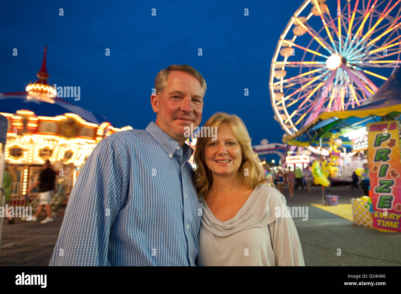 A couple enjoying the amusement park at the Maryland State Fair ...