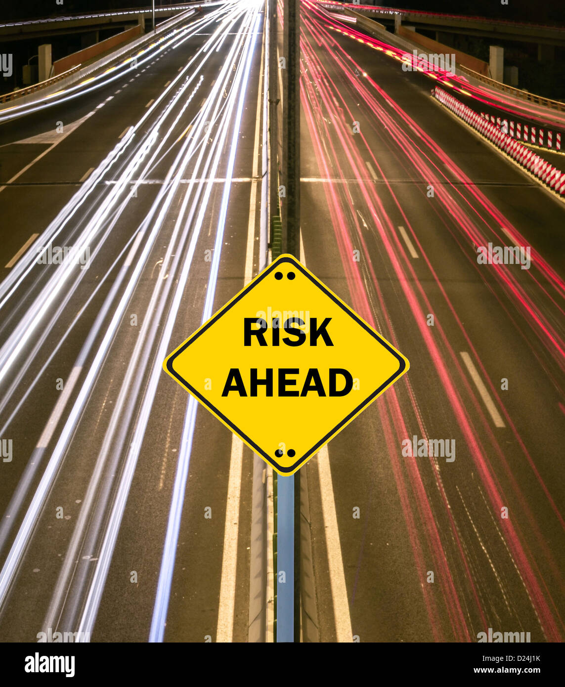 "RISK AHEAD" sign against highway trails Stock Photo - Alamy