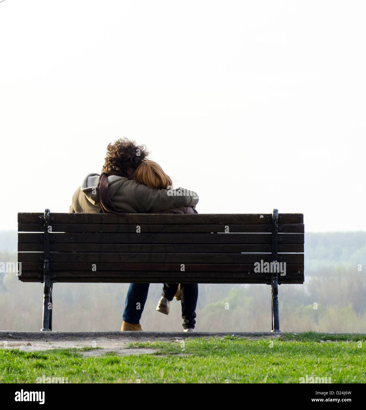 Romantic couple on bench Stock Photo - Alamy