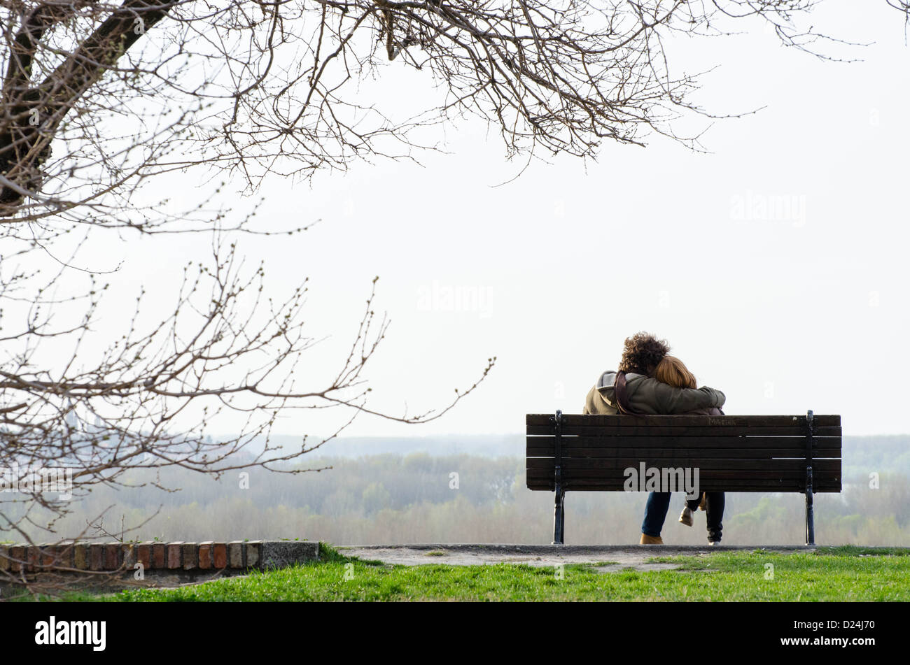 Romantic couple on bench Stock Photo - Alamy