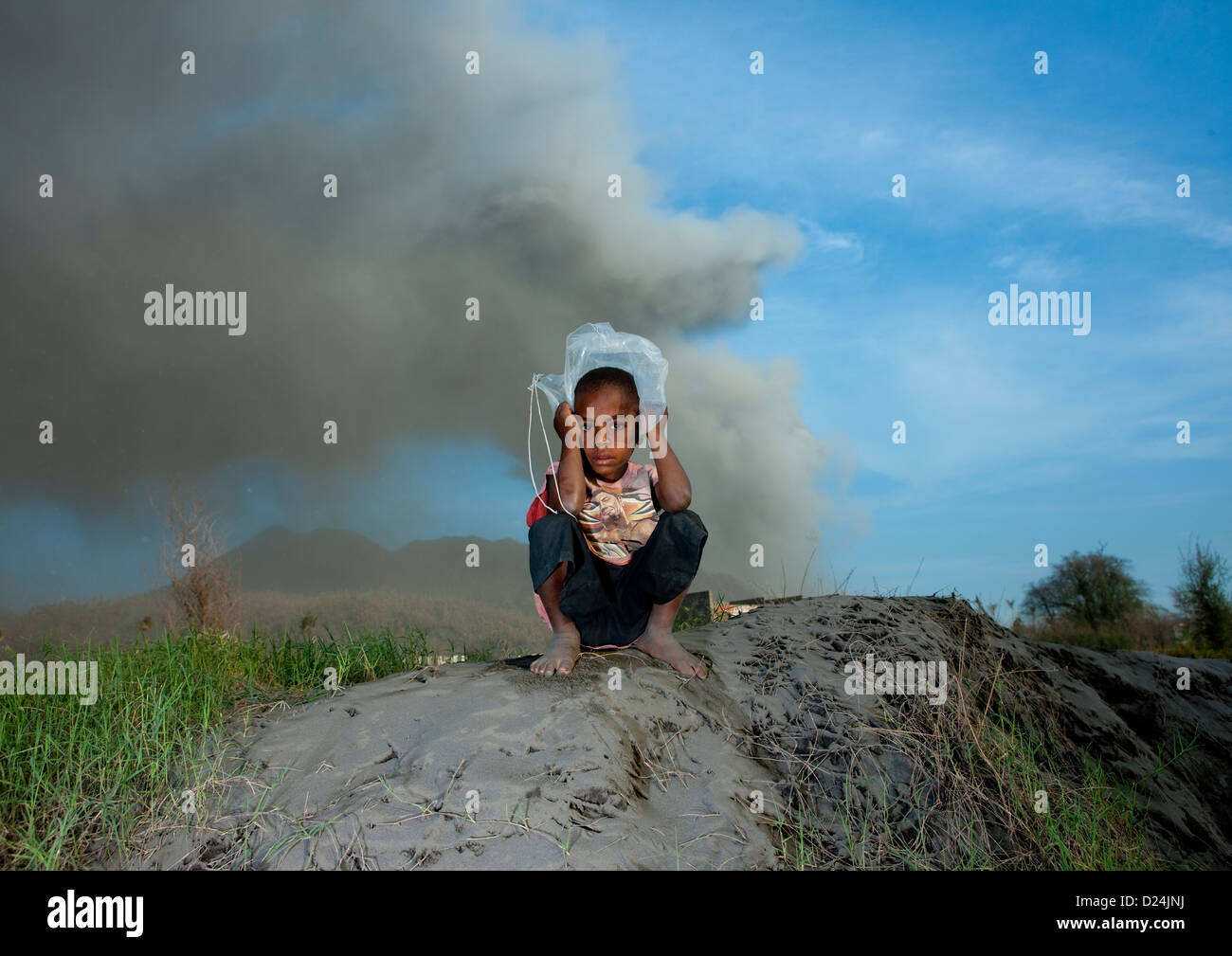 Kid Under A Volcanic Eruption In Tavurvur Volcano, Rabaul, New Britain ...