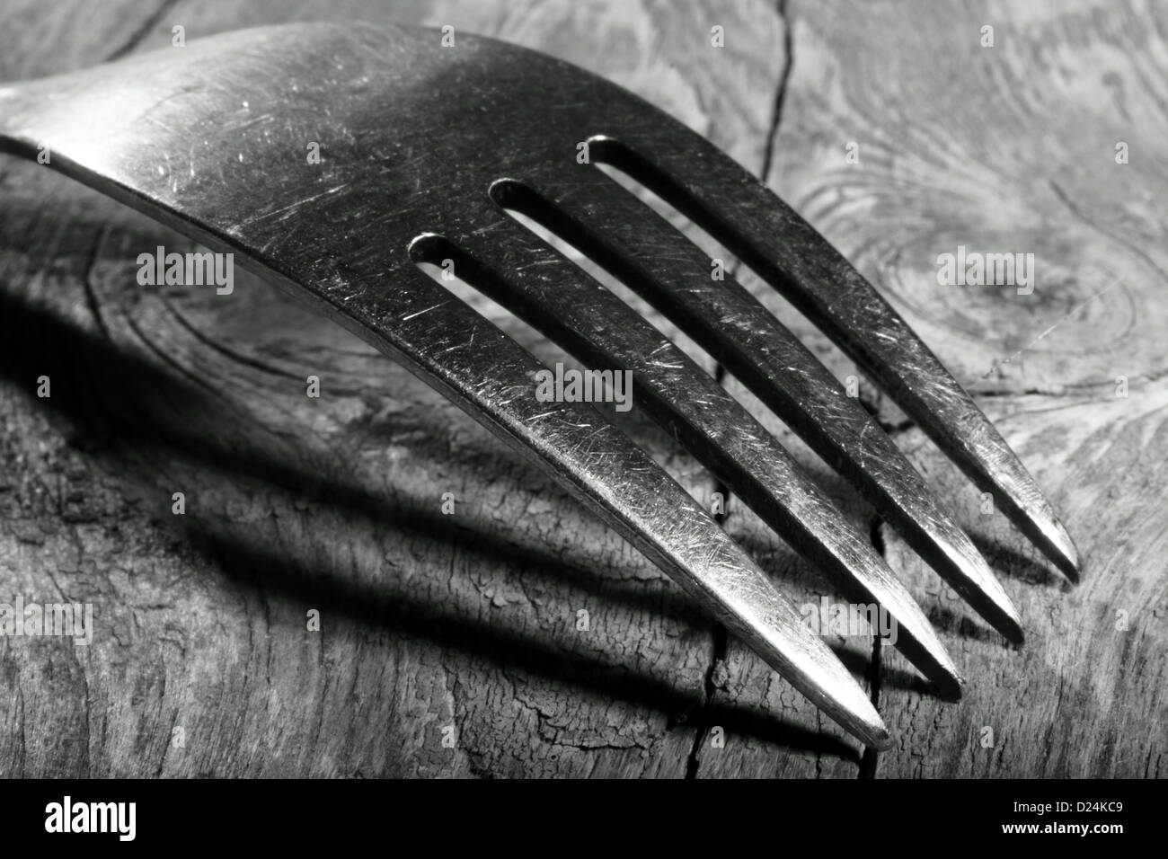 antique fork on an old wooden table Stock Photo - Alamy