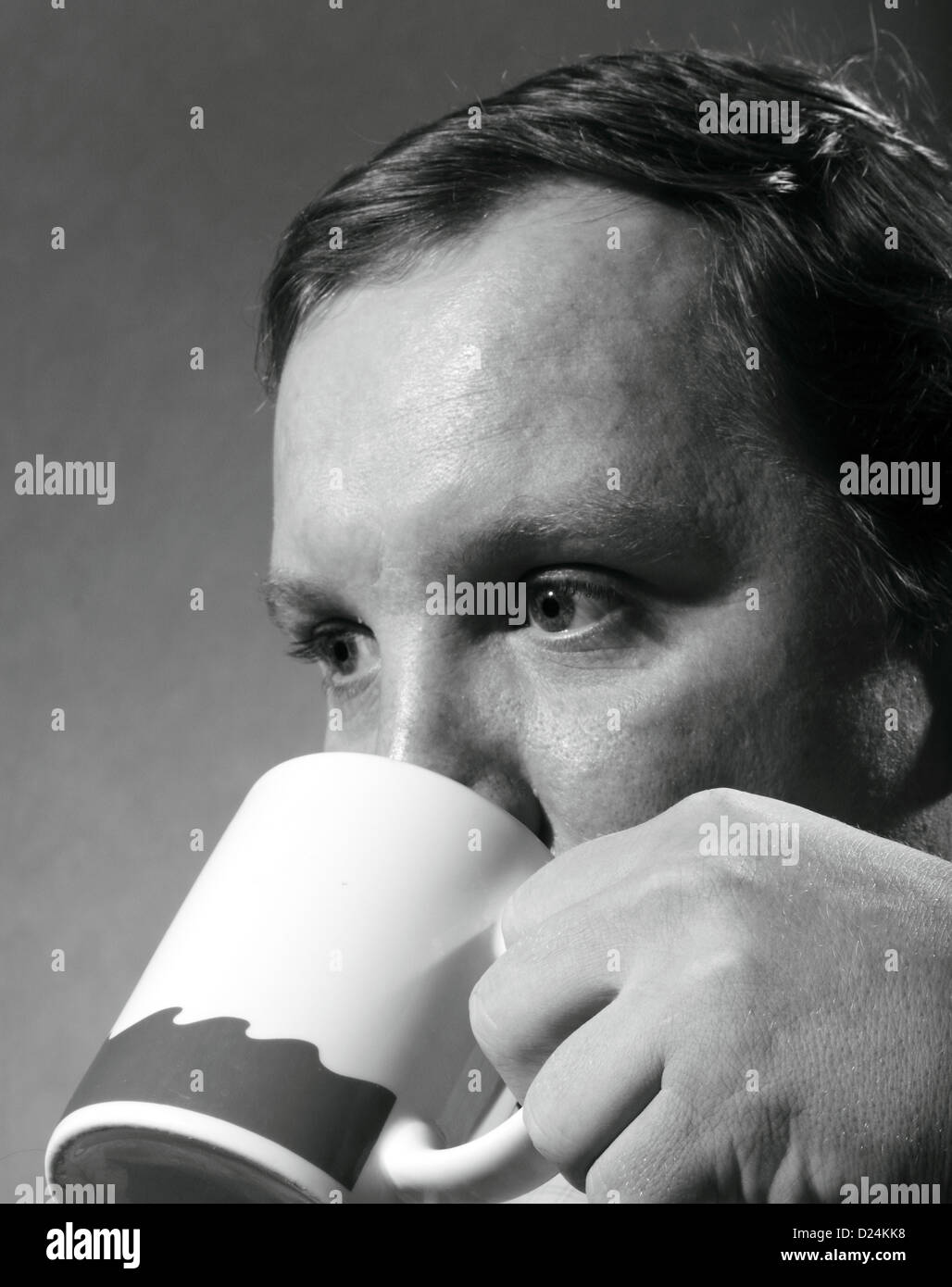 young man drinking tea Stock Photo - Alamy