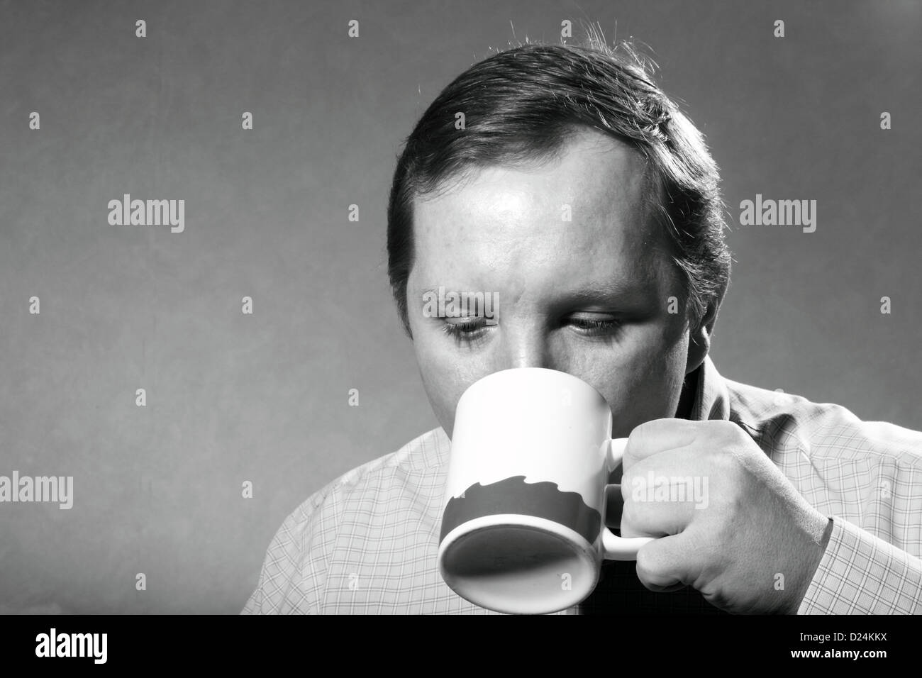 young man drinking tea Stock Photo - Alamy