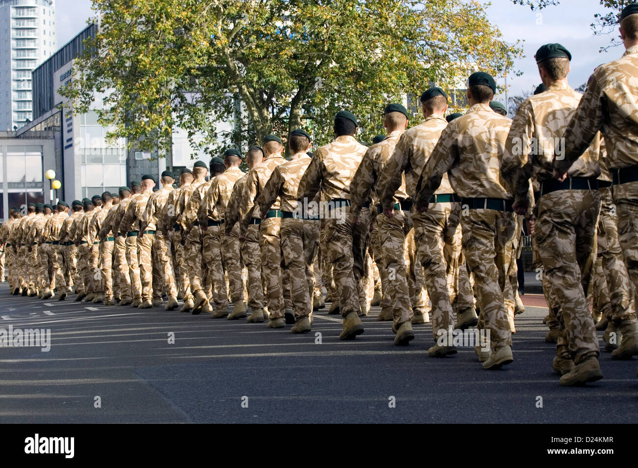 A column of British soldiers marching through Croydon at a welcome home ...