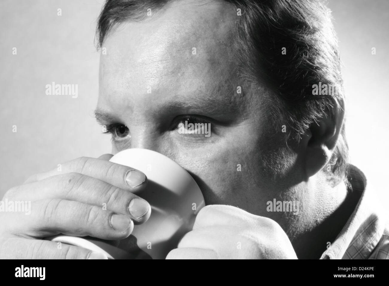 Man holding cup tea Black and White Stock Photos & Images - Alamy
