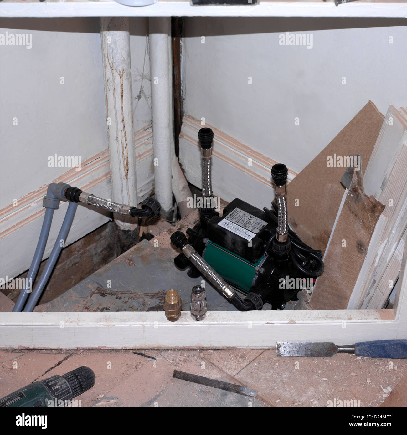 Motor for Power Shower Being Installed into Cupboard in New Bathroom ...