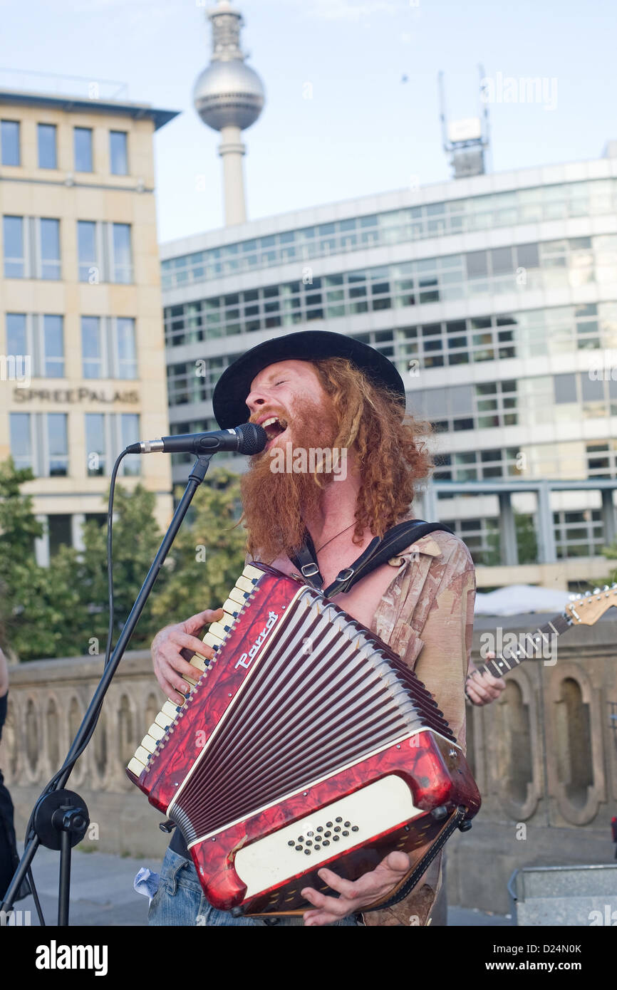 Berlin, Germany, street musician plays on the Friedrichsbruecke in ...