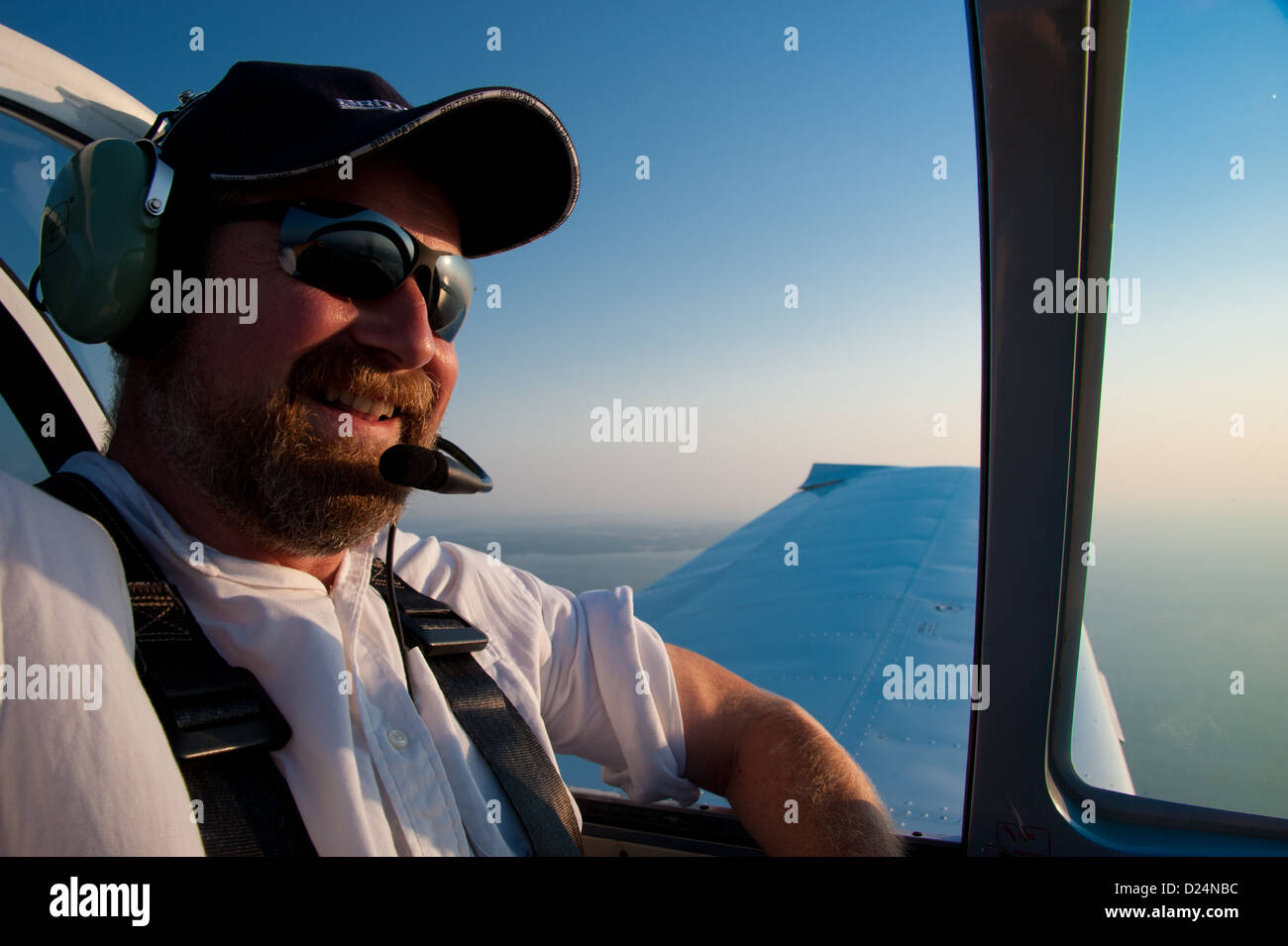 Pilot flying small plane, Tecnam P2002 Sierra 619BV plane flying Stock ...