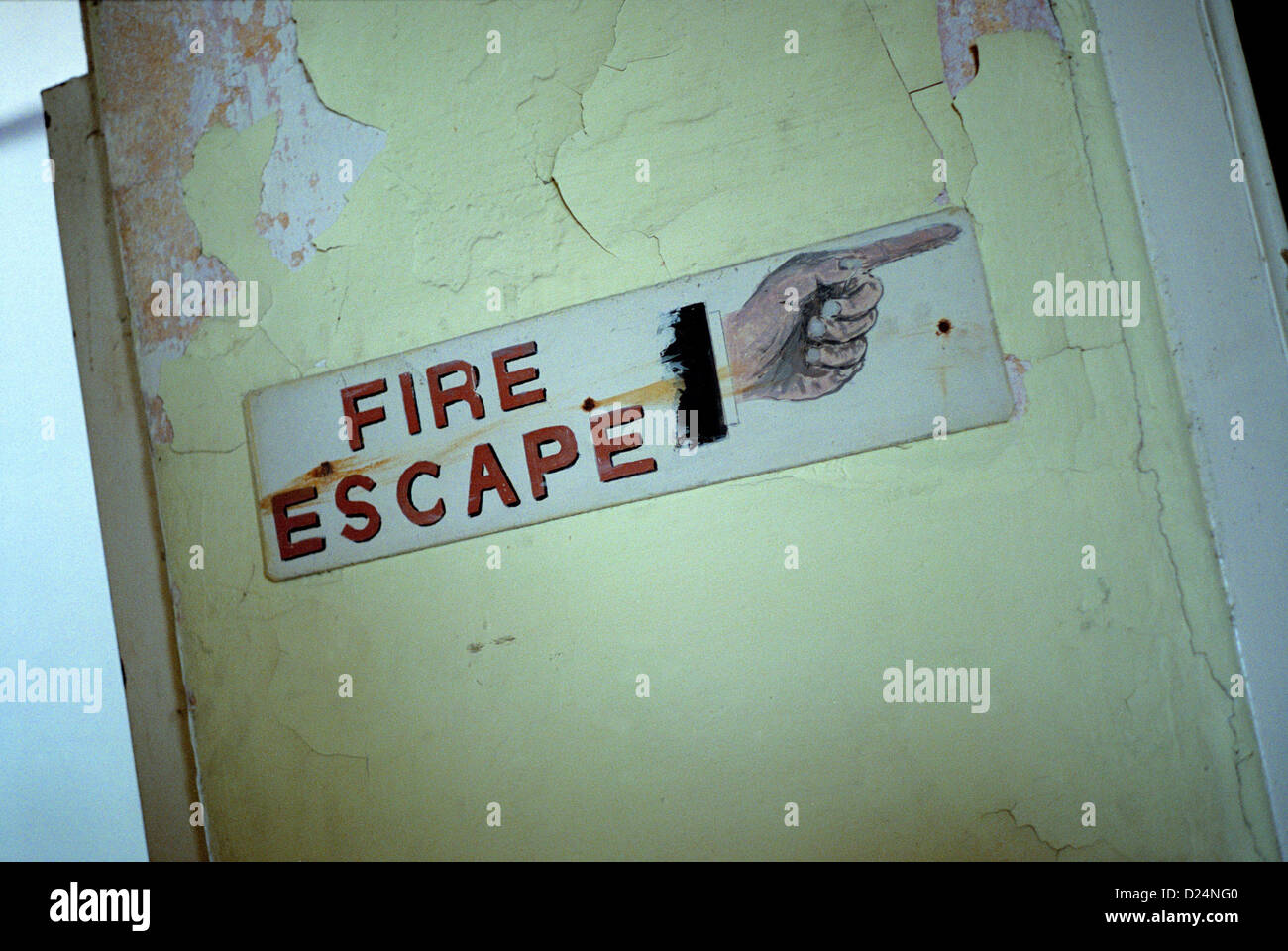 Hand painted fire escape sign, pointing hand Stock Photo - Alamy