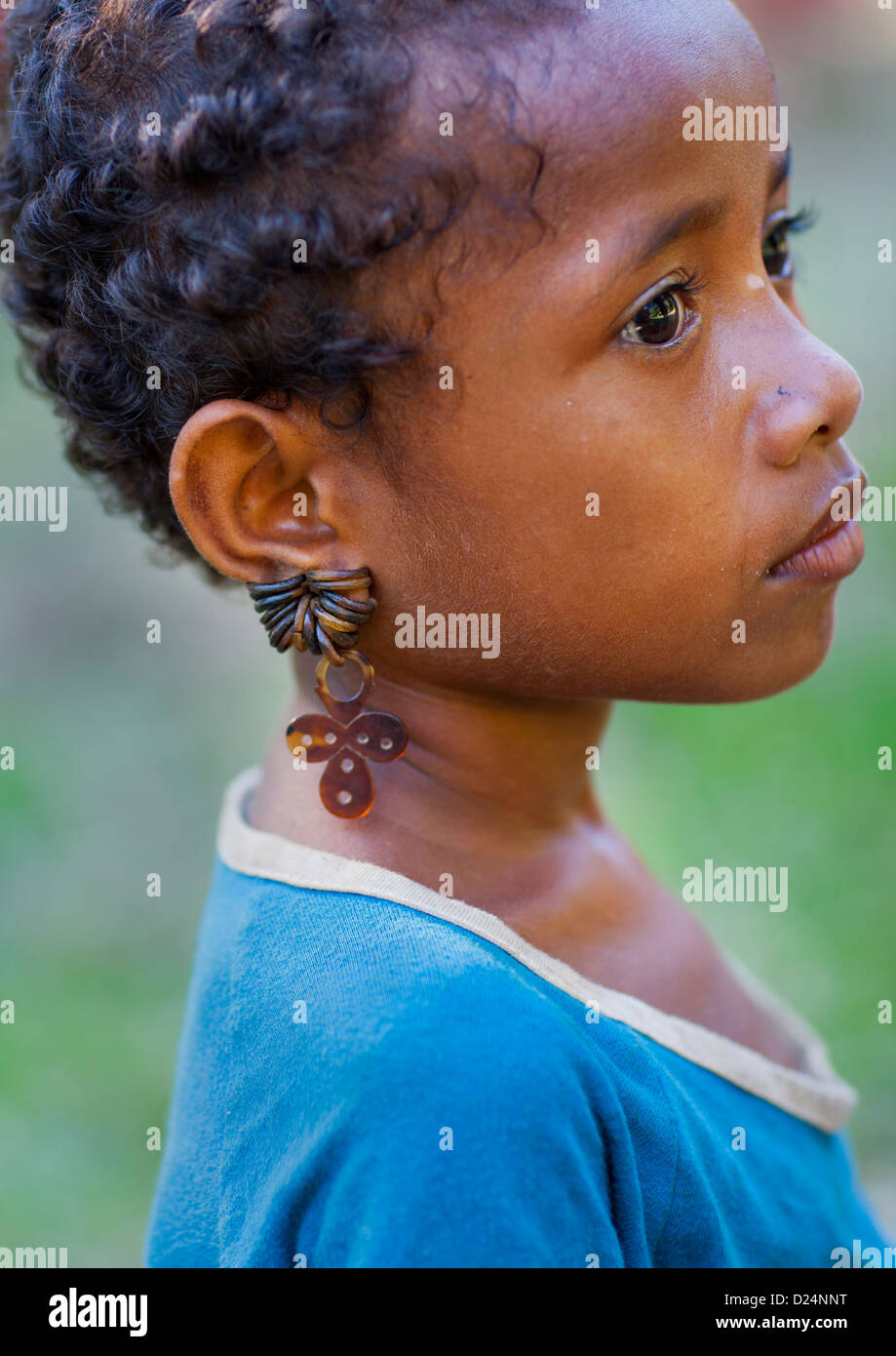 Little Girl Wearing Ear Rings Made With Turtle Shells, Trobriand Island ...