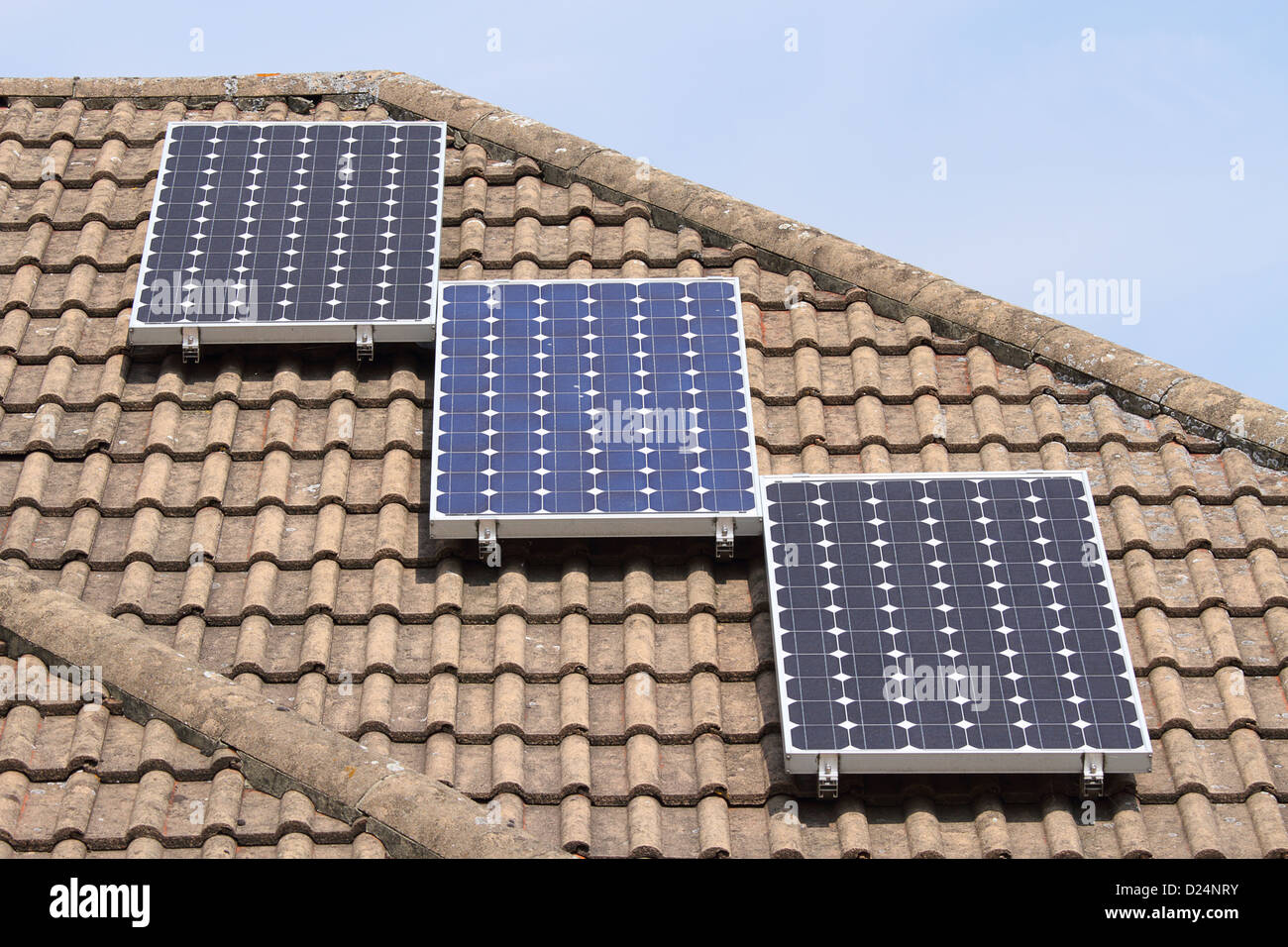 Solar photovoltaic panels on tiled house roof Stock Photo - Alamy