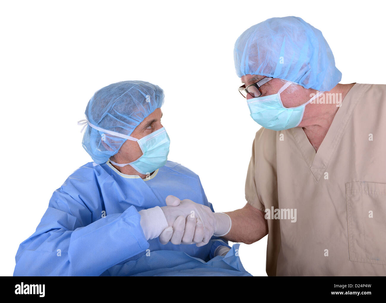 Two surgeons shaking hands Stock Photo - Alamy