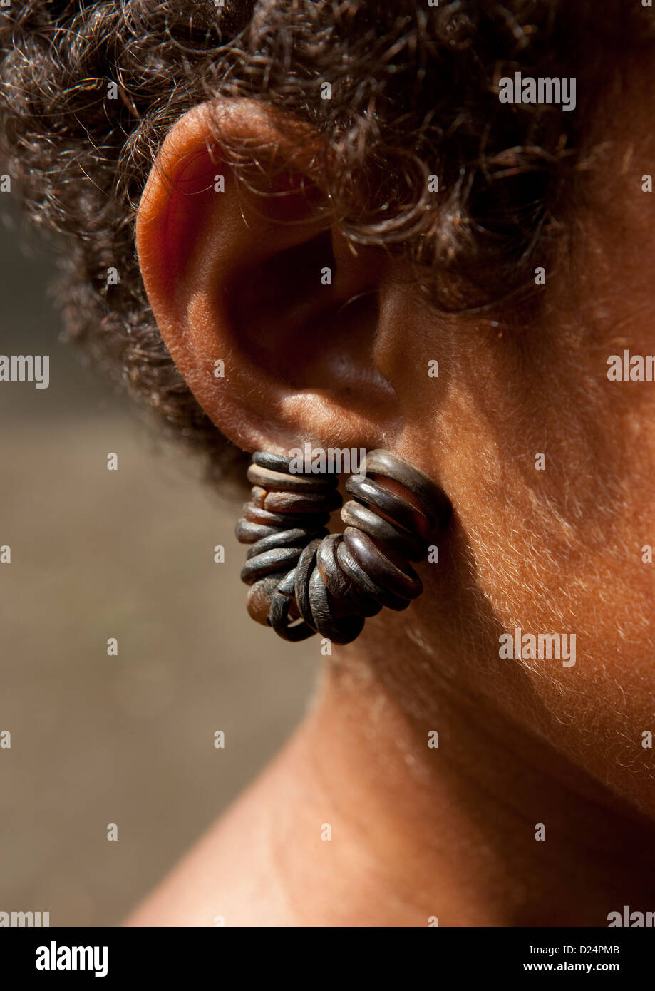 Little Girl Wearing Ear Rings Made With Turtle Shells, Trobriand Island ...