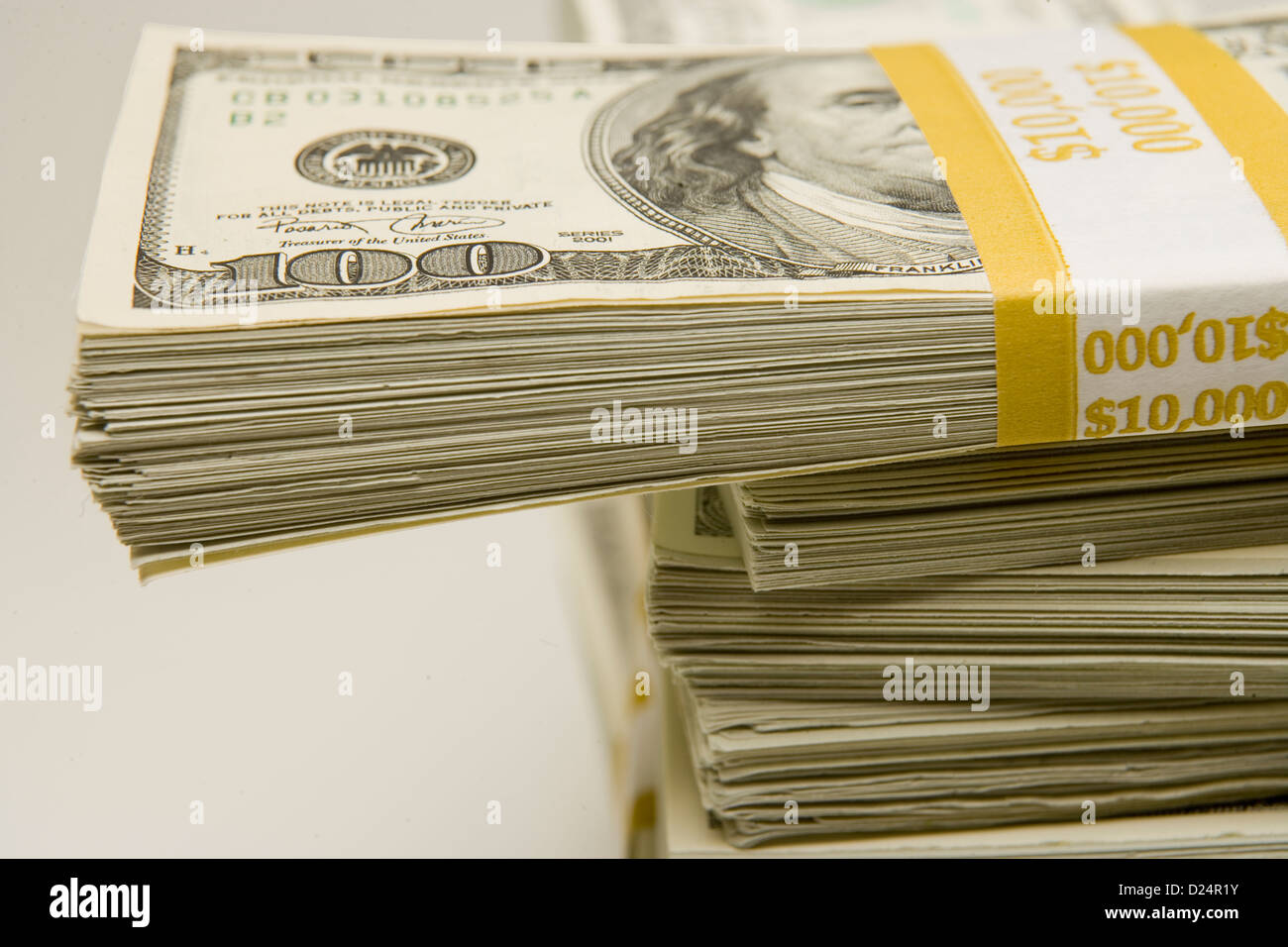 Stacks of $100 bills banded in $10,000 amounts Stock Photo - Alamy