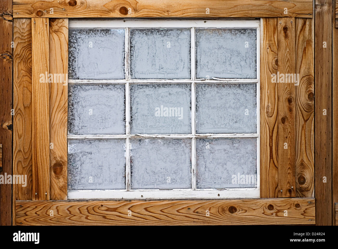 Horizontal image of an old wooden nine-lite window pane in a wooden ...