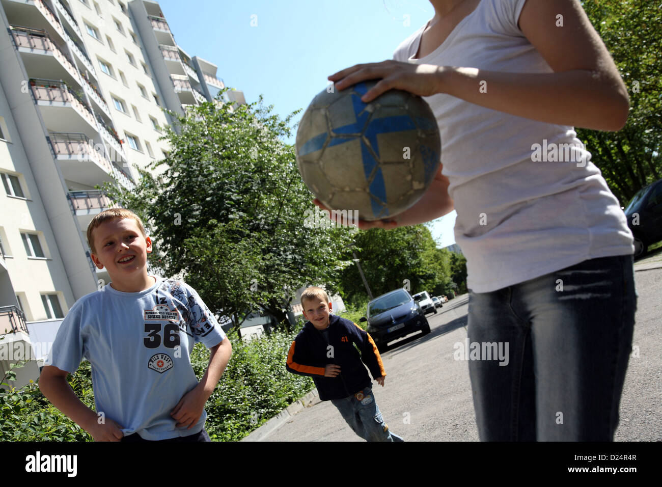 Berlin, Germany, children playing ball in a housing development in ...