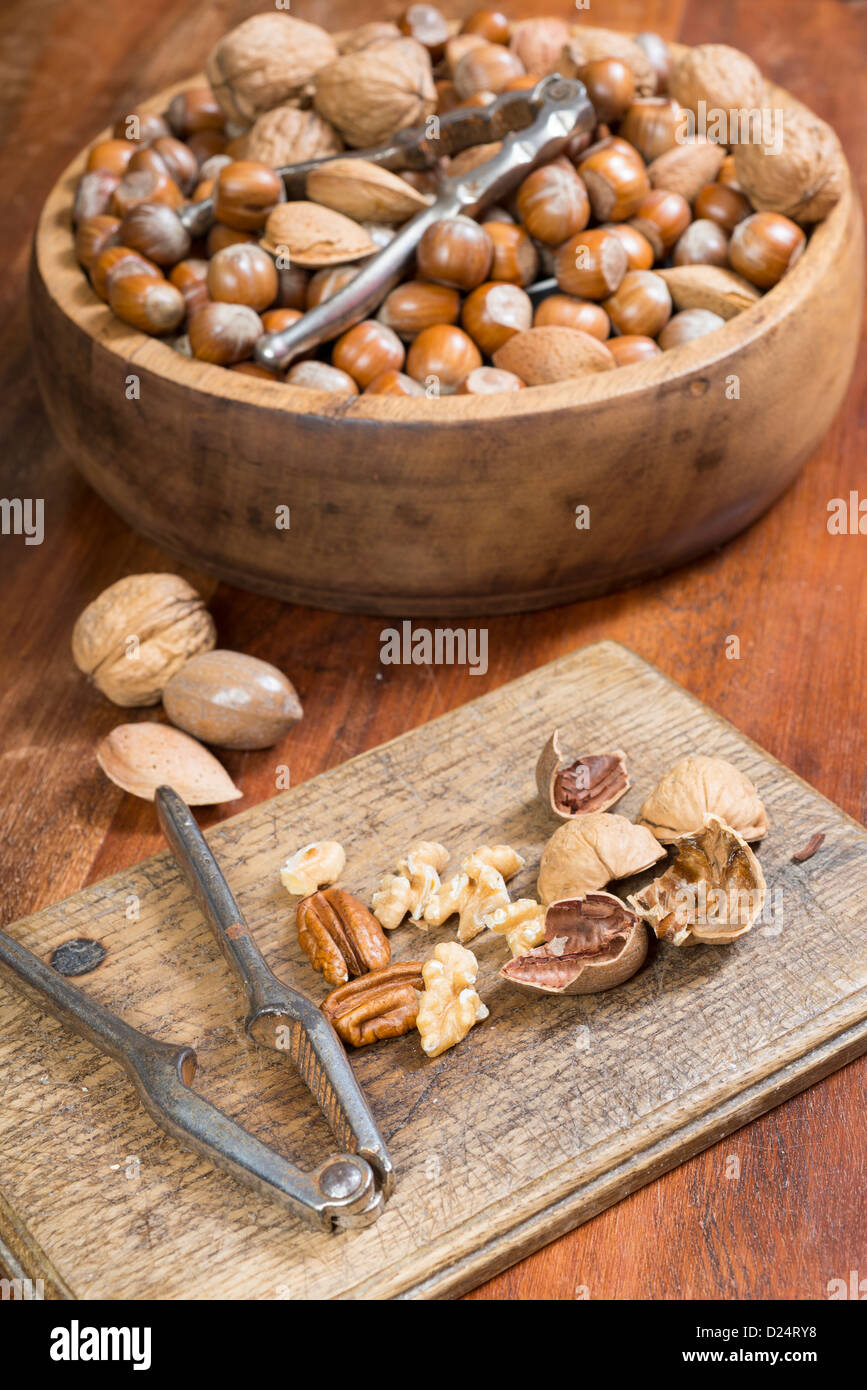 Edible nuts and nutcrackers on a table at home in a christmas setting ...