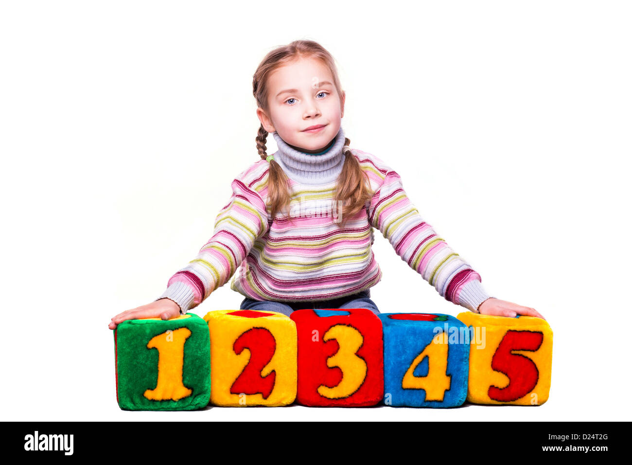 Happy girl holding blocks with numbers over white background Stock ...