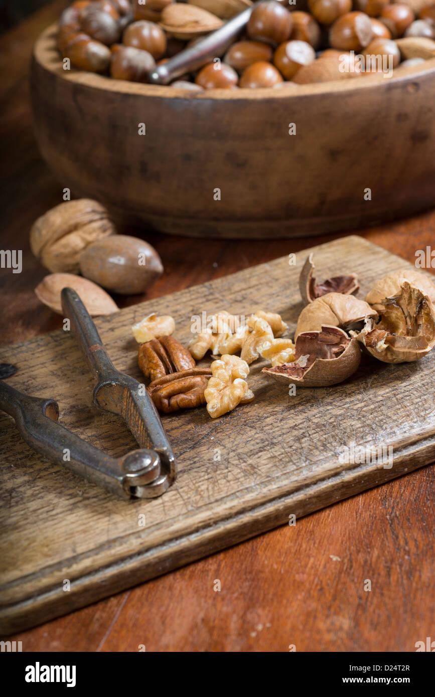Edible nuts and nutcrackers on a table at home in a christmas setting ...